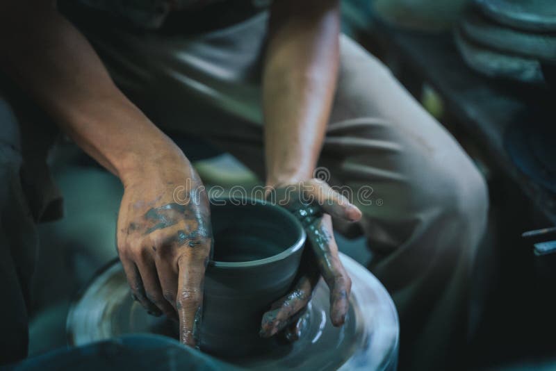 A Long Exposure Shot of Man Making Sculpture Art from Soil and Mud with ...