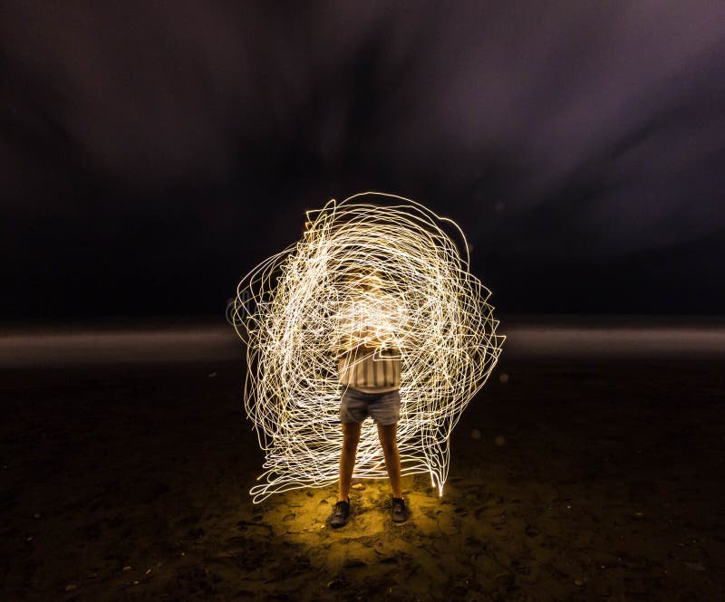 Long Exposure Shot of a Man Surrounded by Light Circles Stock Photo ...