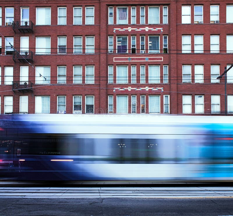 Long Exposure Shot of the Moving Train in Front of a Building Stock ...