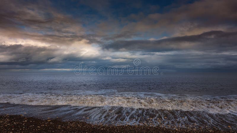 Long Exposure Shot of the Ocean Under a Beautiful Cloudy Sky. Stock ...