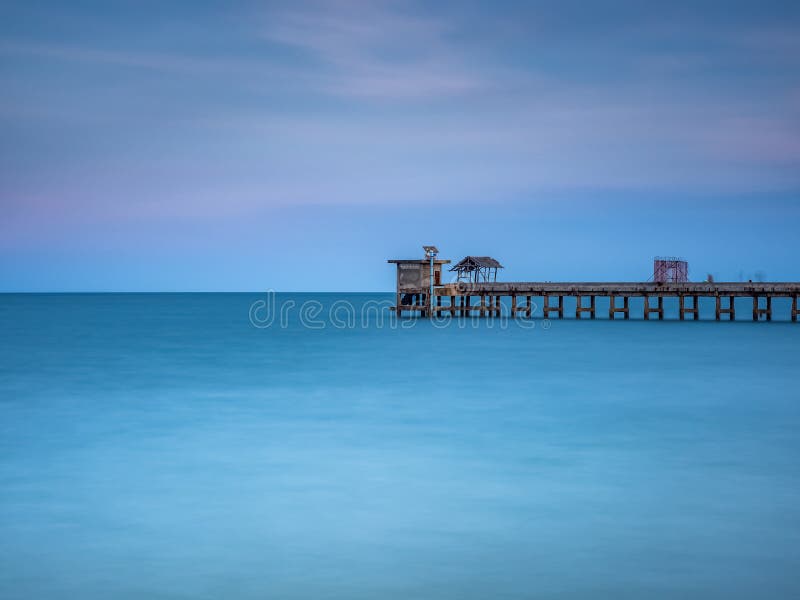 Long Exposure Shot of an Old Bridge Built Jutting into the Sea Stock ...