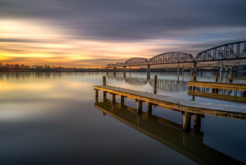 Long Exposure Shot of a Sunset Over Wooden Docks and a Bridge. Stock ...