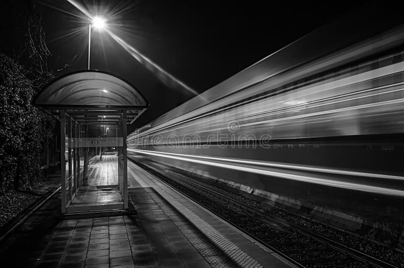 Long Exposure Shot of a Train at an Empty Station at Night Stock Image ...