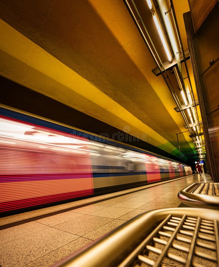 Long Exposure Shot of a Train in Motion Along an Empty Railway Platform ...