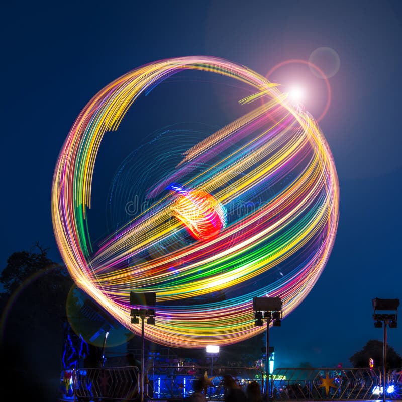 Long Exposure of a Spinning Fairground Ride Stock Photo - Image of ...