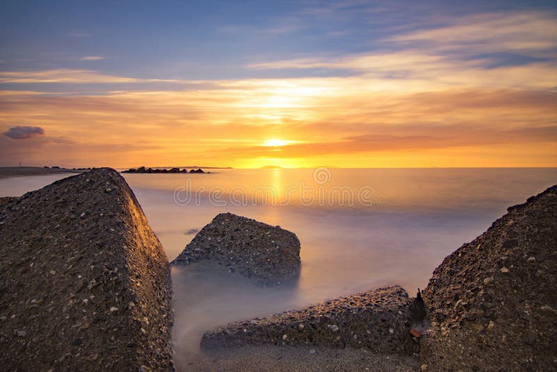 Long exposure sunset stock image. Image of waves, sand - 73635995