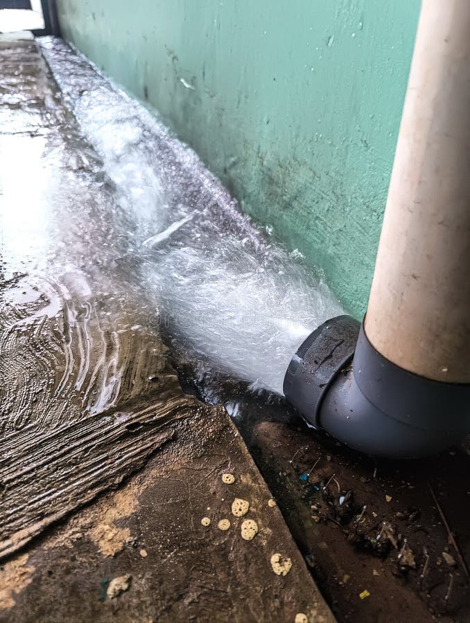 Water Coming Out of a Gutter Drain Pipe Stock Image - Image of freezing ...