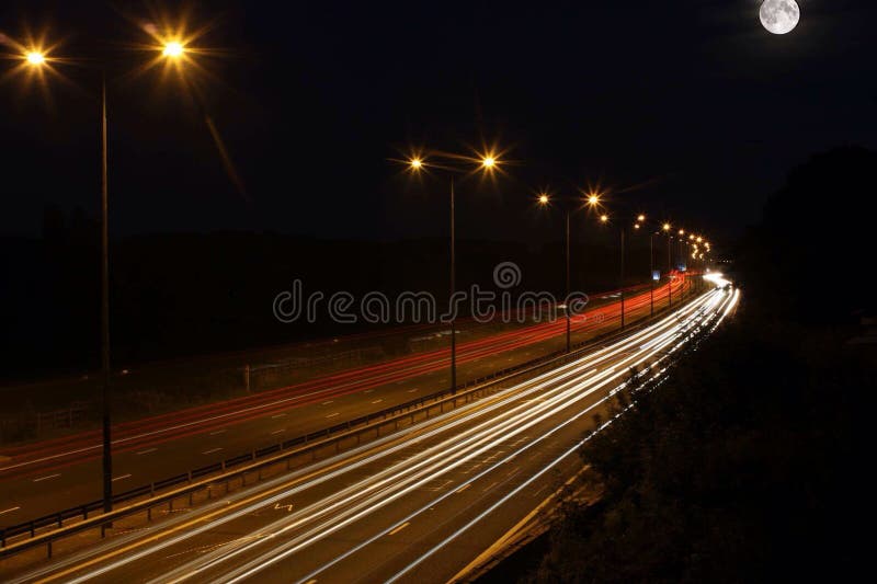 Long Exposure Traffic with Moon Above Stock Image - Image of composite ...