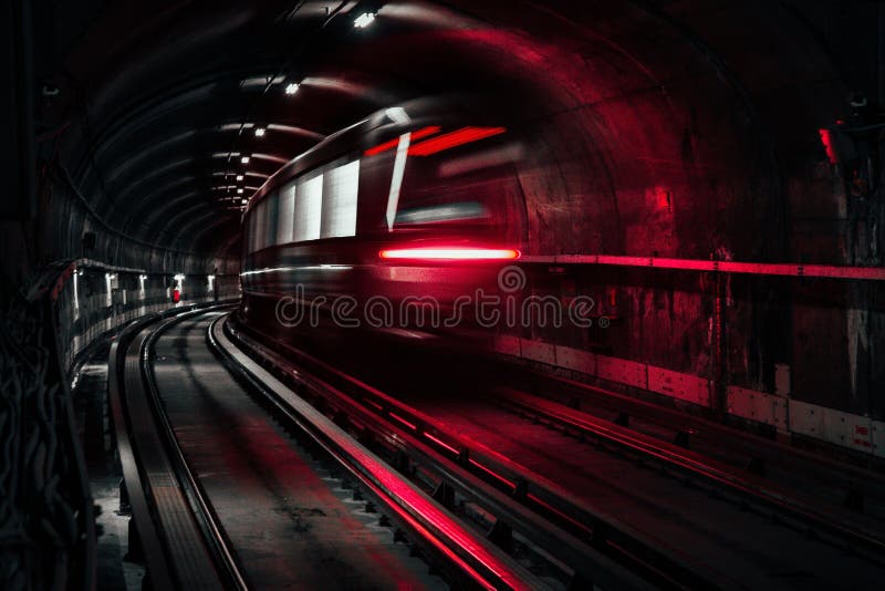 Long Exposure of a Train Driving Underground Illuminated by Red Lights ...