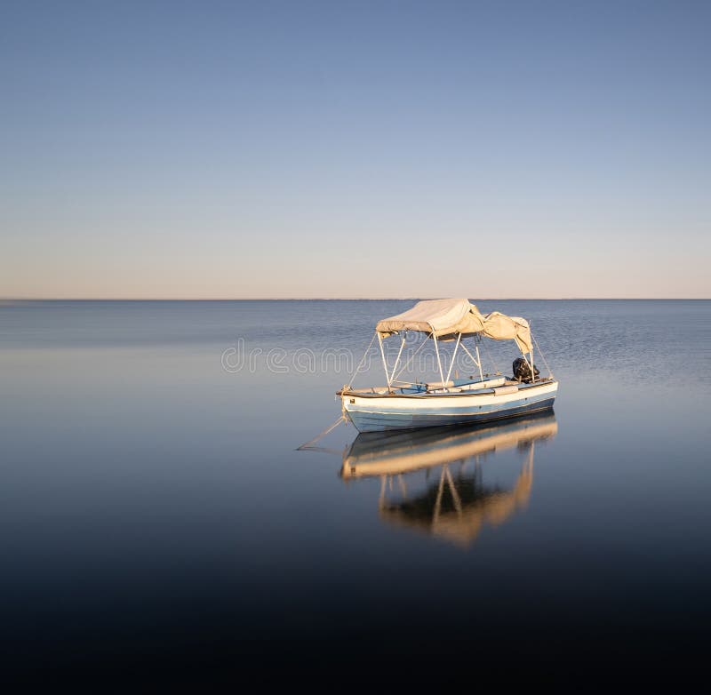 Long Exposure View of a Small Boat with Cloth Ceiling in the Water ...