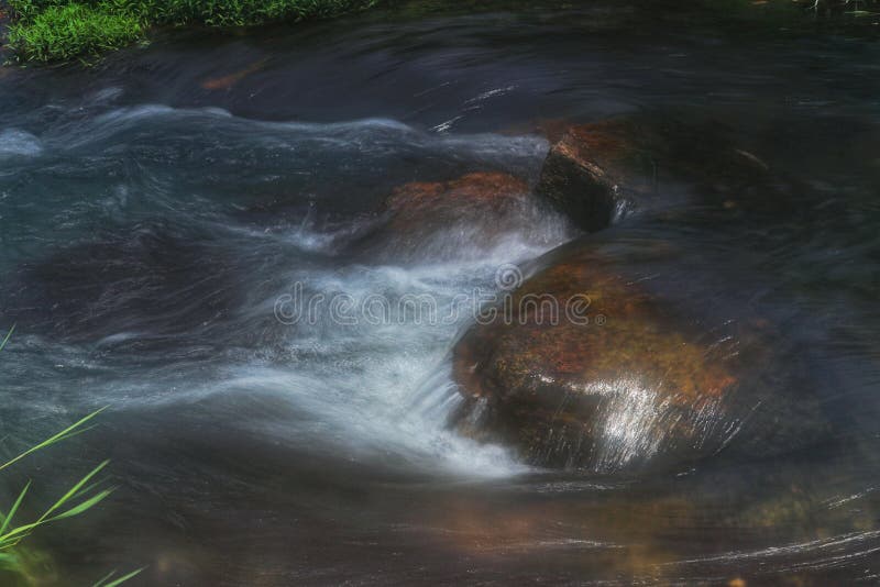 Long Exposure of Water Flow Over Rock Stock Photo - Image of water ...