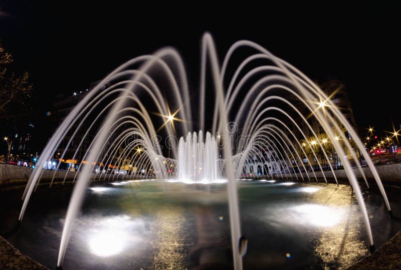 Long Exposure of a Water Fountain Captured with Its Lights on at Night ...