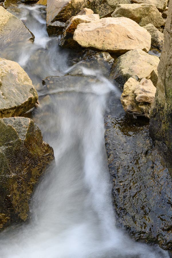 Long Exposure of Water Running To River at Vertical Composition Stock ...