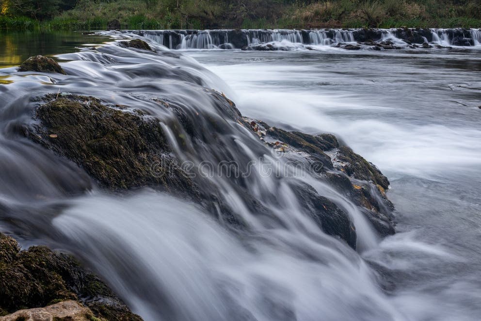 Long Exposure of the Water Sliding through the Rocks on a Dum Stock ...