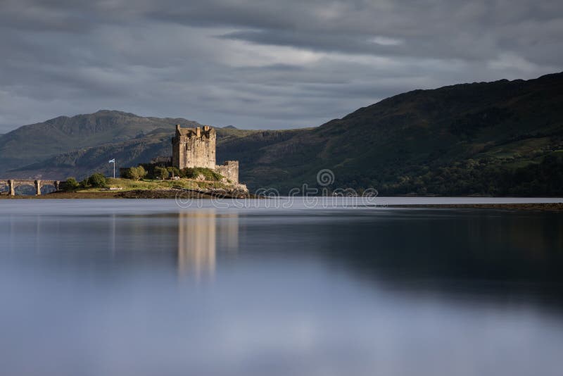 Long Exposure Waterside View of Eilean Donan Castle Under the Cloudy ...