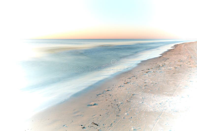 Long Exposure of Waves Washing on Empty Beach with Copyspace at Sunset ...