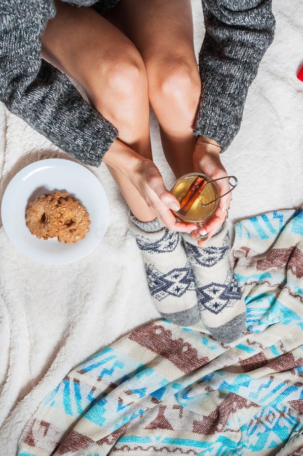 Long Female Feet in Warm Woolen Socks with Cup of Tea Stock Image ...