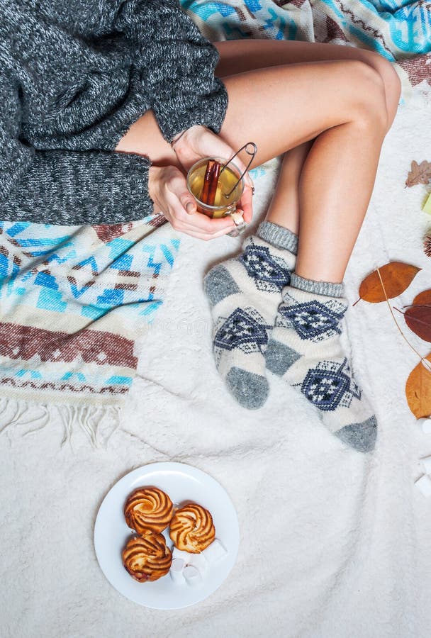 Long Female Feet in Warm Woolen Socks with Cup of Tea Stock Image ...