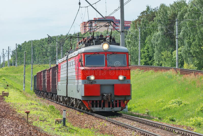 Long Freight Train Approaches Stock Image - Image of approach, cargo ...