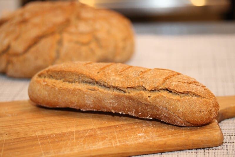 Long French Bread on the Cutting Board. Stock Photo - Image of fresh ...