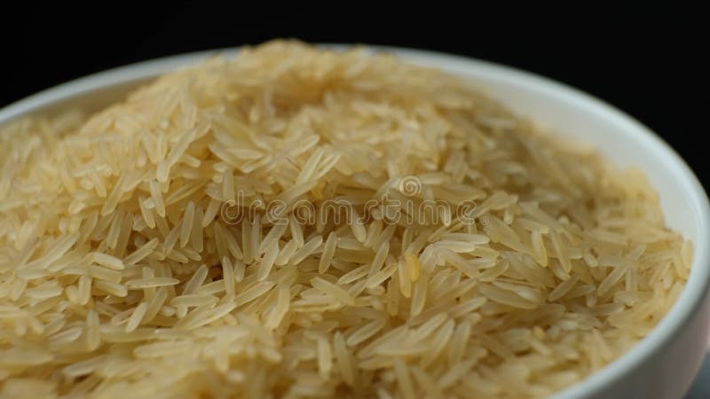 Long Grain Parboiled Basmati Rice Rotating on Black Background Stock ...