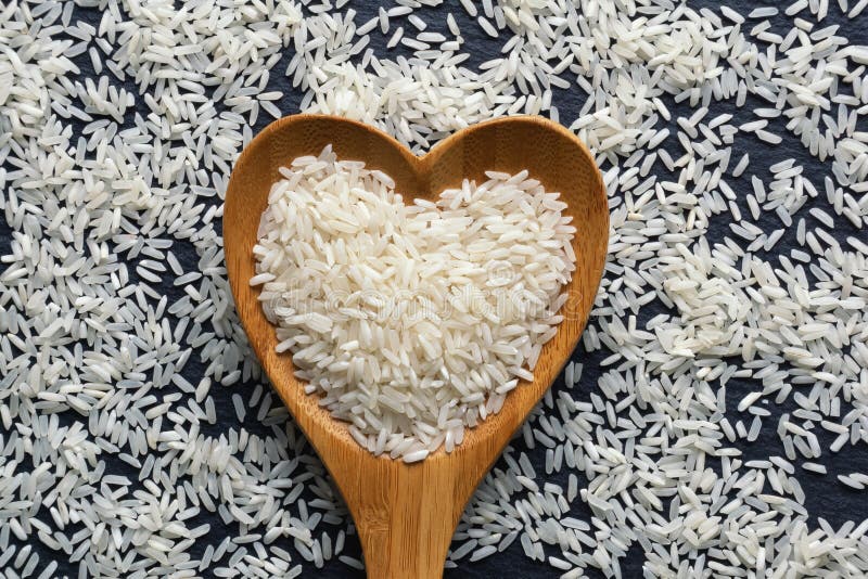 Long Grain Rice in Heart Shaped Spoon Stock Photo - Image of uncooked ...