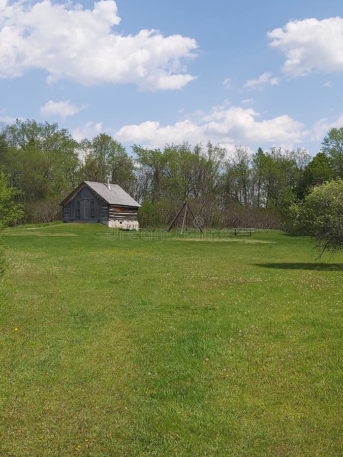 Long Grass Field with Homestead Log Cabin Stock Photo - Image of plant ...