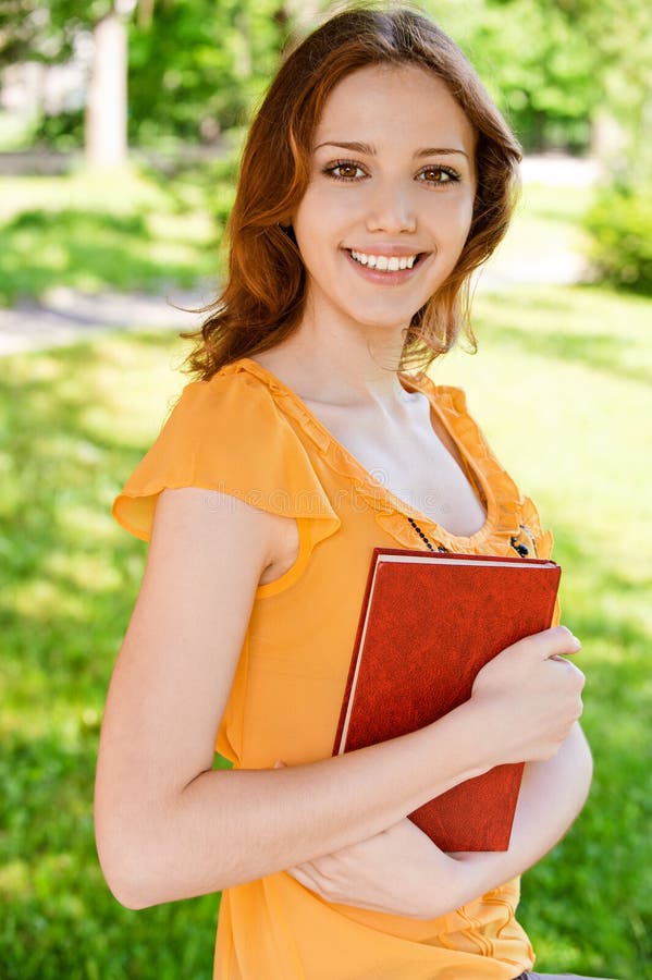 Long-haired girl with book stock image. Image of leisure - 15302369