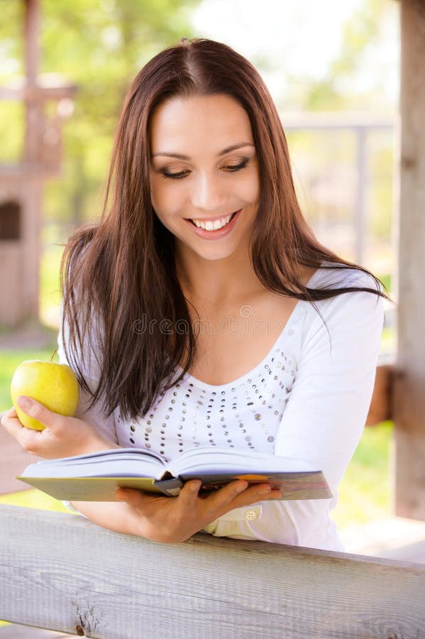 Long-haired Girl Reads Book Stock Image - Image of glad, cheerful: 14236525
