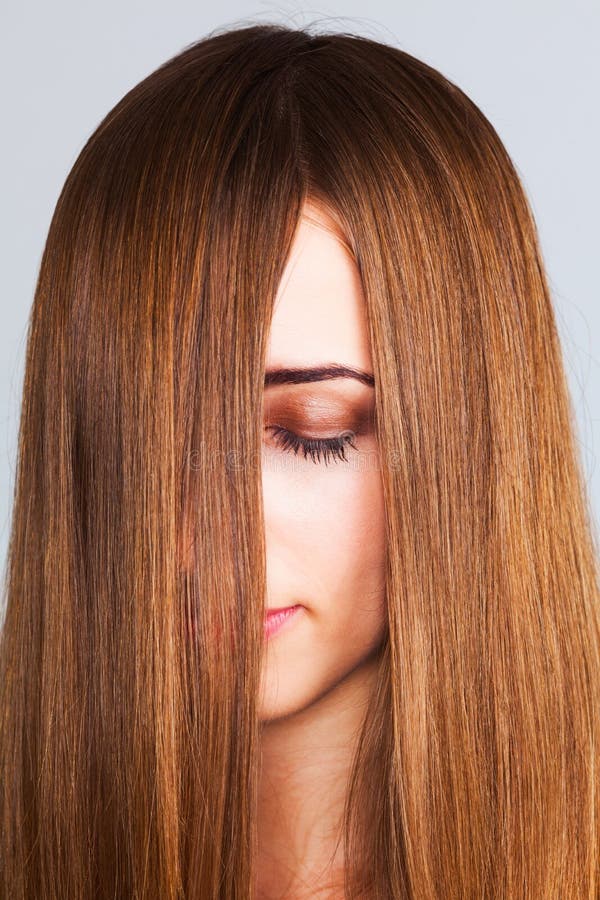 Slim Woman Brushing Her Hair Over Face Stock Image - Image of black ...