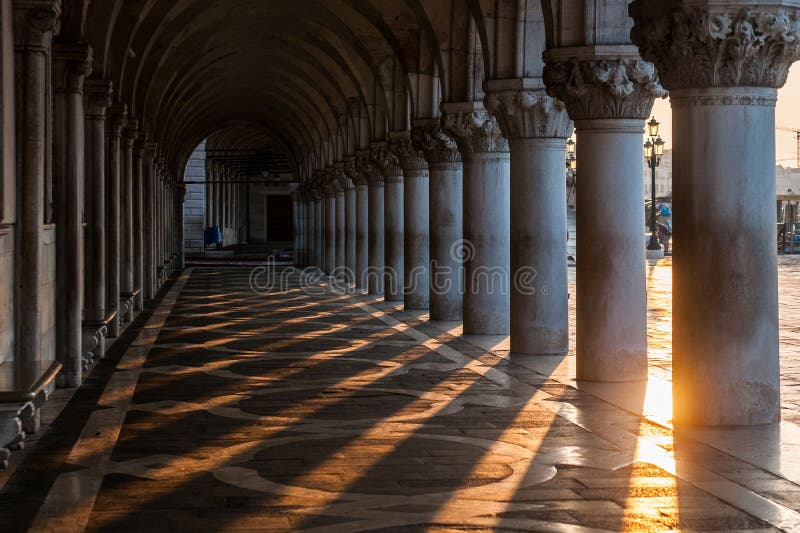 Long Hallway of a Building with Pillars at Sunset Stock Photo - Image ...
