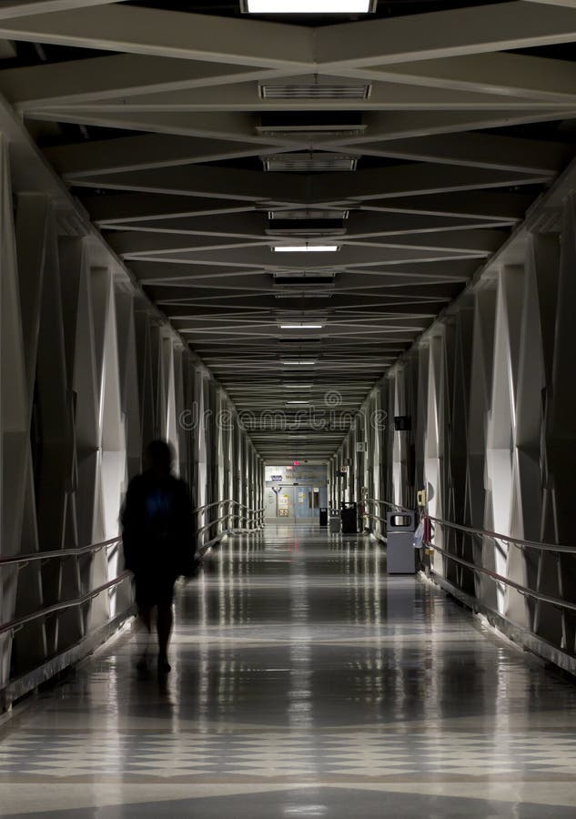 Long Hallway Corridor Passage at Night Stock Image - Image of person ...