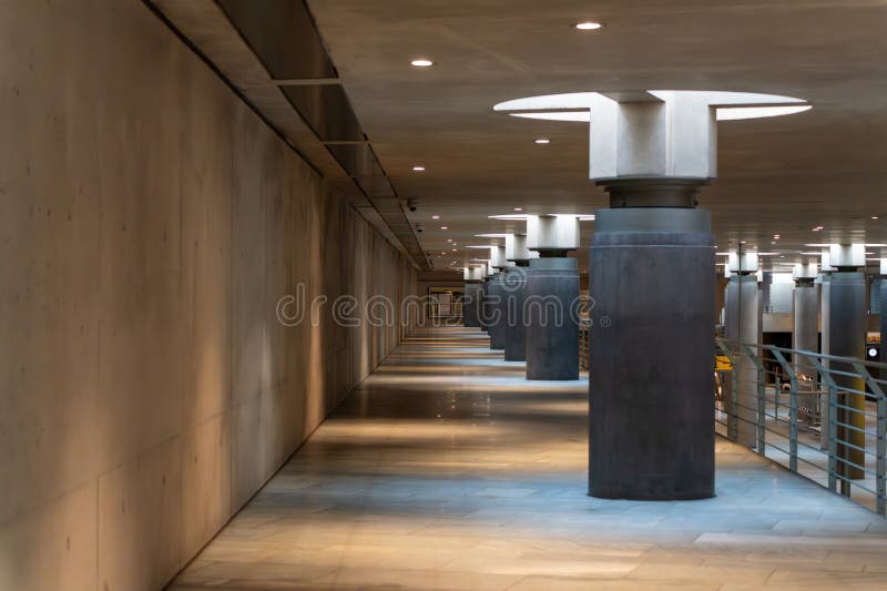 A Long Hallway with a Bench in the Middle Stock Image - Image of urban ...