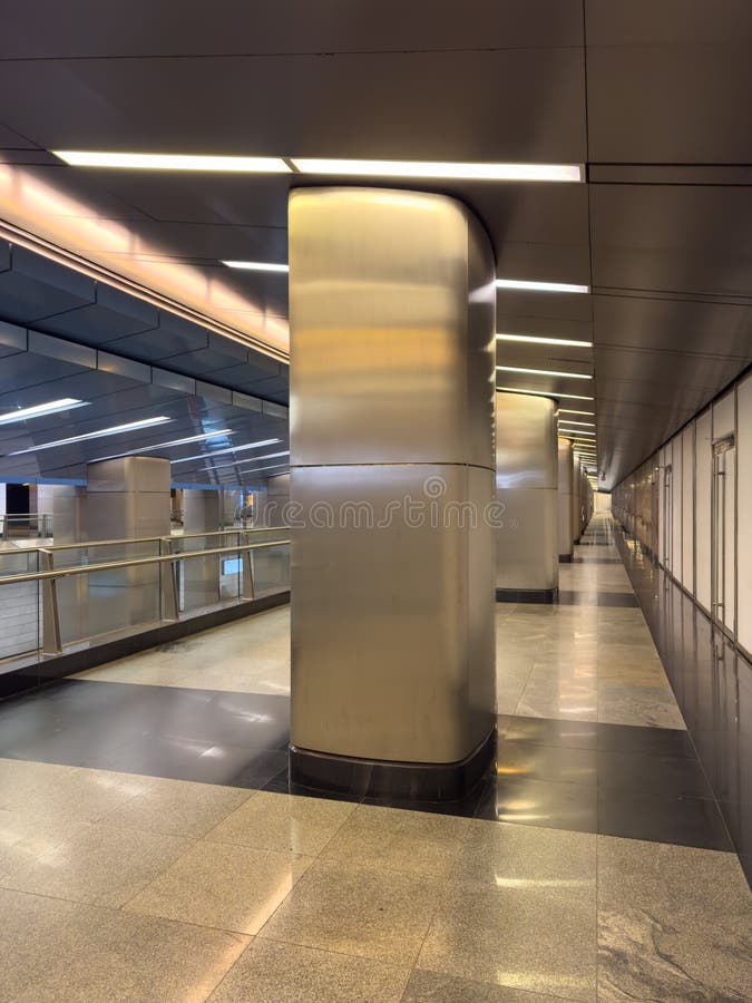 A Long Hallway with a Silver Pillar in the Middle Stock Photo - Image ...