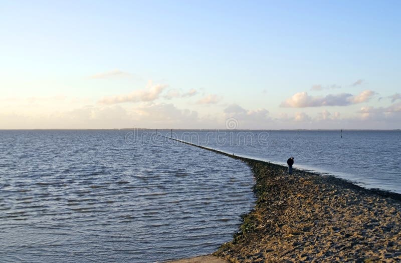Long harbour mole in sea stock photo. Image of shingle - 3439802