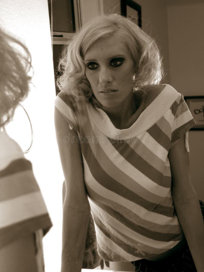 Long Hard Look in the Mirror Stock Image - Image of woman, lady: 1179717