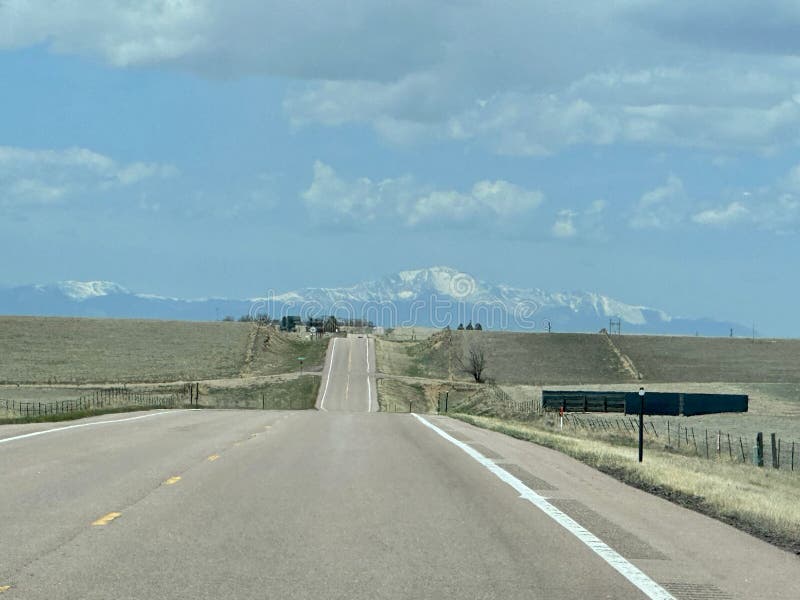 Long Highway Running through an Expansive Open Field Stock Photo ...