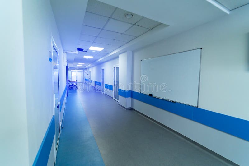 Long Hospital Hall in Light White and Blue Colors. Many Doors and ...
