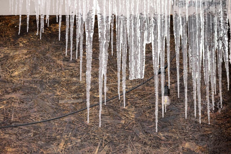 .long Icicles Hanging from the Edge of the Roof Stock Image - Image of ...
