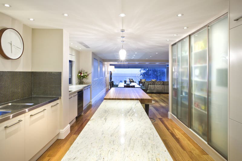 Long Kitchen Island and a Table Editorial Photography - Image of bright ...