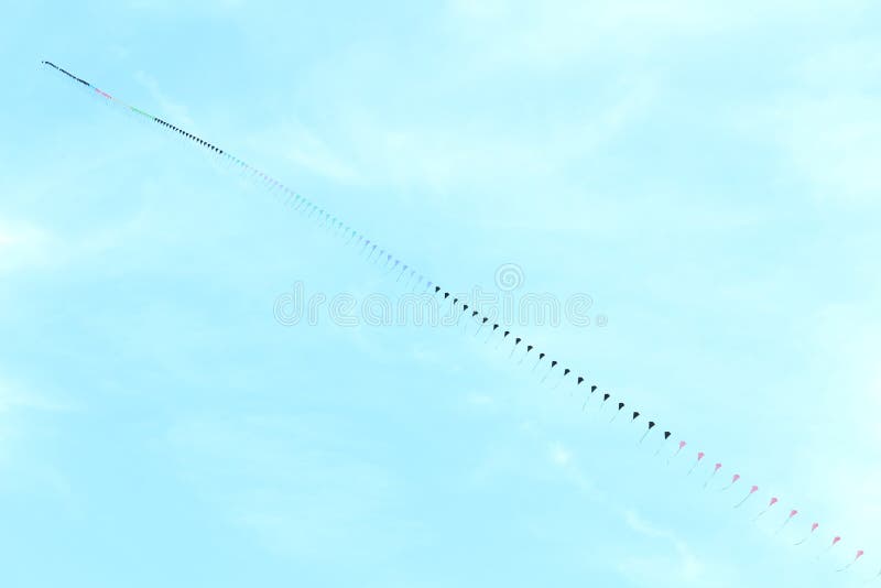 Long kite in the blue sky stock illustration. Illustration of kite ...