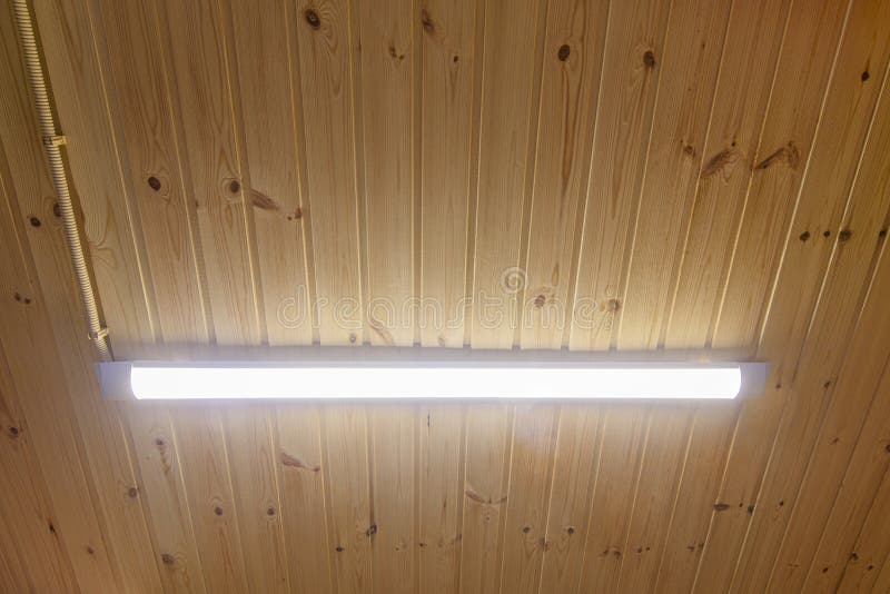 Long LED Lamp on Wood Paneling Ceiling Stock Image - Image of wooden ...