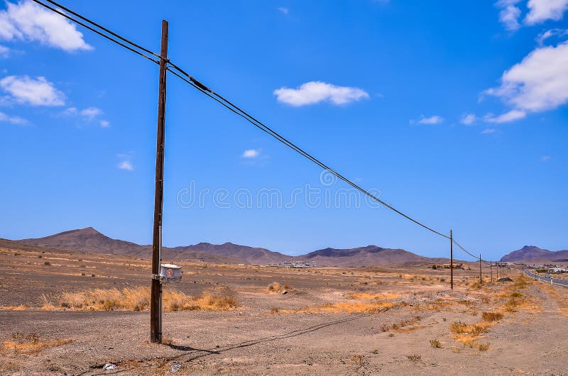 A Long Line of Power Poles are in the Desert Stock Image - Image of ...