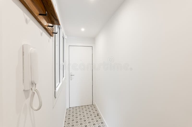 Long Lobby with Window and Intercom on White Wall at Home Stock Image ...