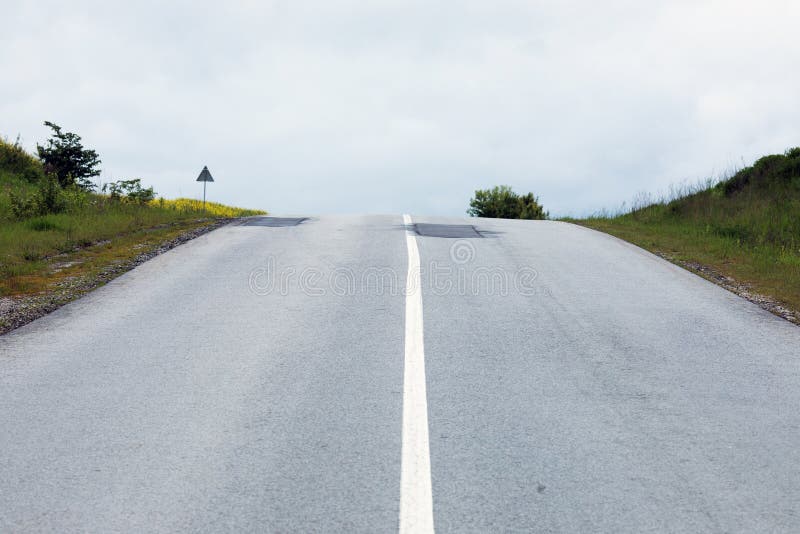 Long Lonely Old Asphalt Road with a White Solid Stripe Stock Image ...