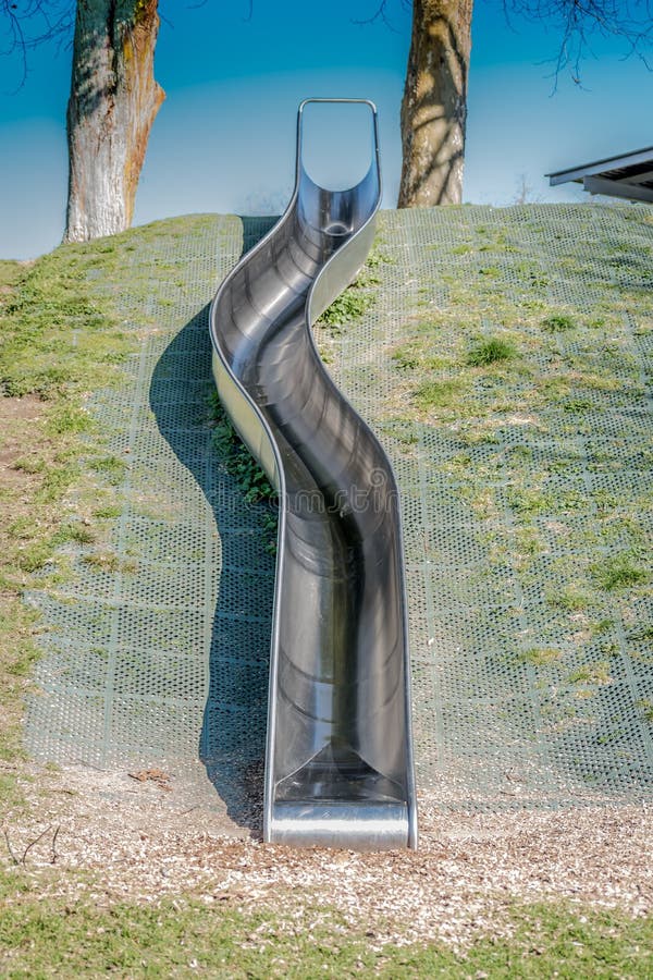 Long Metal Slide on Playground Stock Image - Image of outdoor, slide ...