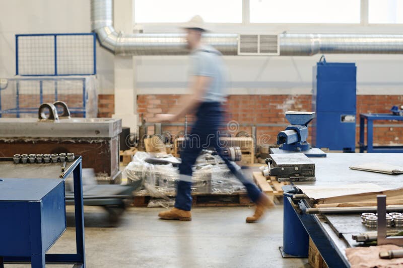 Unrecognizable Man at Work in Factory Motion Blur Stock Image - Image ...