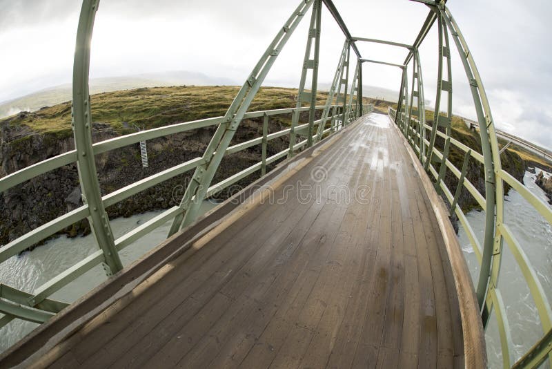 Long Narrow Walking Bridge in Iceland Stock Photo - Image of hill ...
