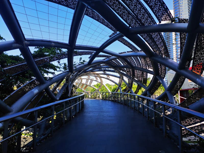 Walking through the Mesh-shaped Steel Long Bridge, Stock Photo - Image ...