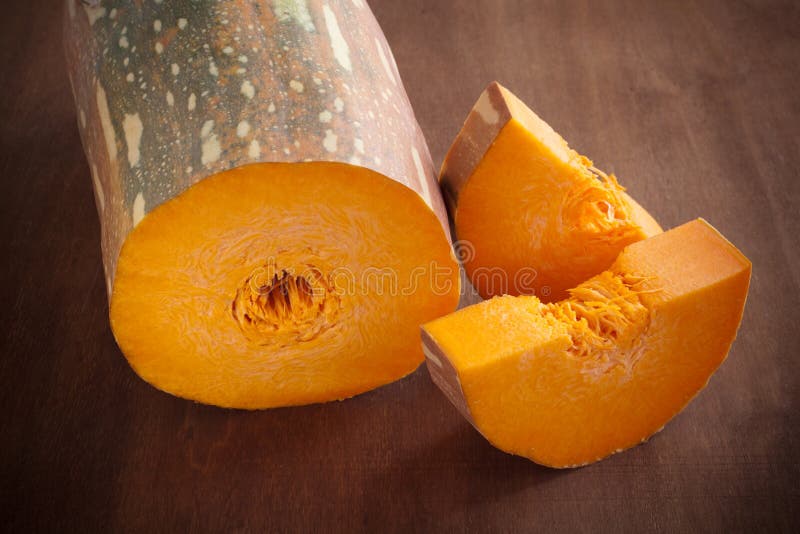 Long orange pumpkin stock image. Image of wooden, piece - 30186623